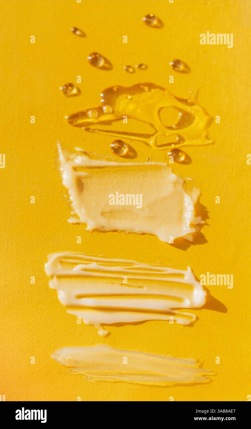 Different texture of gel and cream on a yellow background. Transparent ...