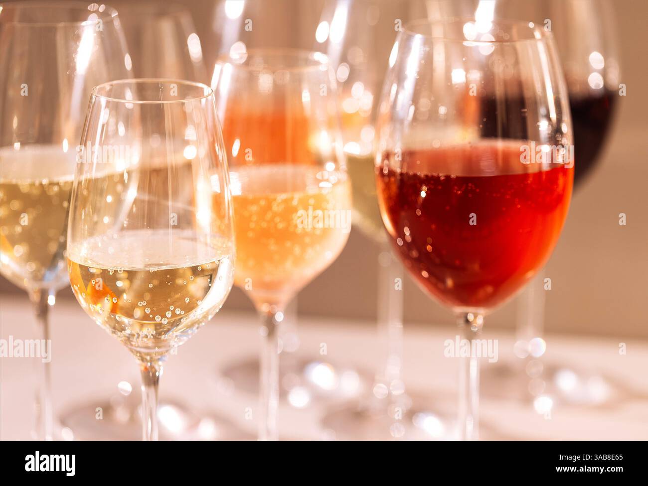 A close-up of elegant glasses with alcoholic beverages. Cups with ...