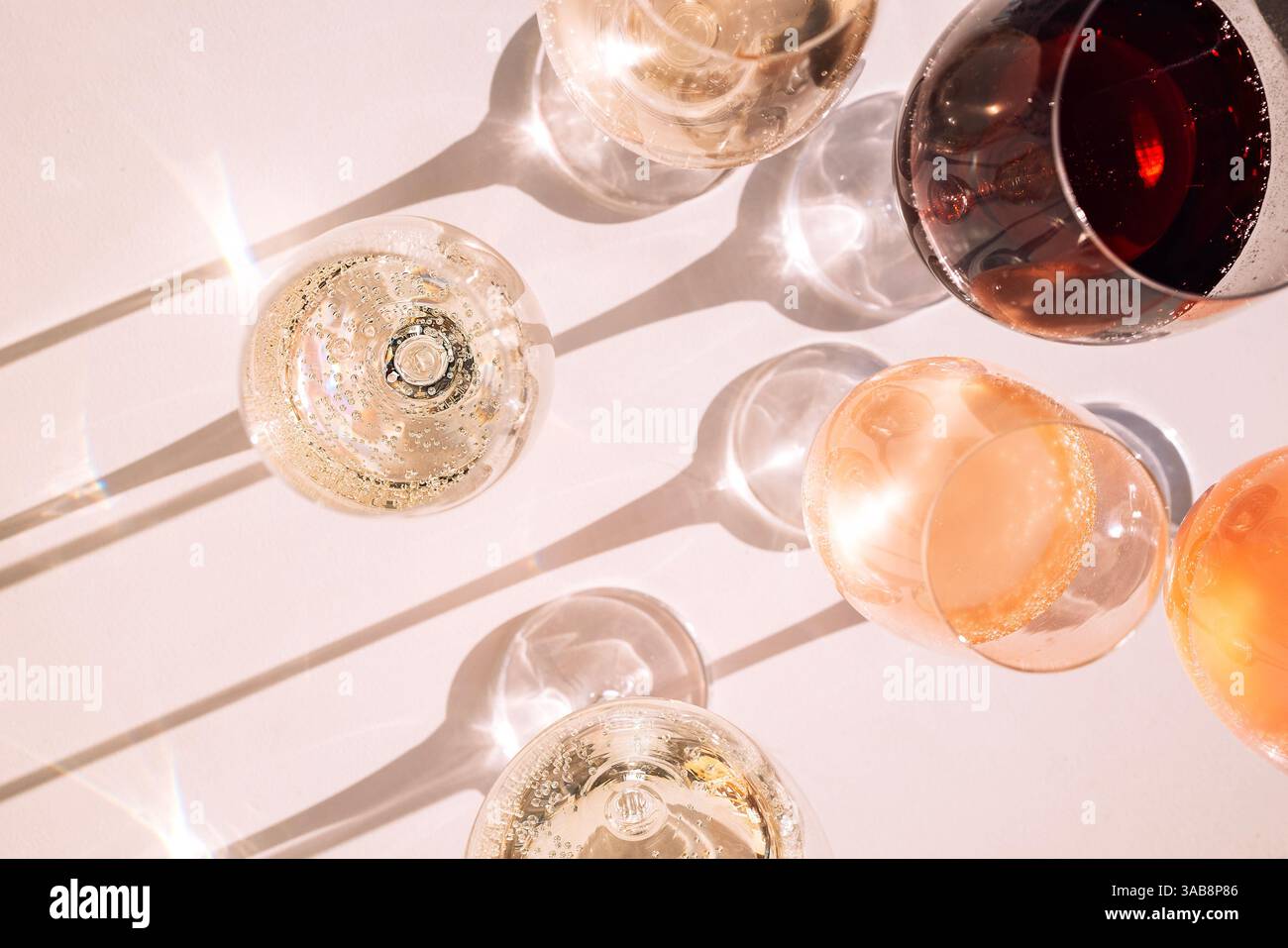 A close-up of elegant glasses with alcoholic beverages. Cups with ...