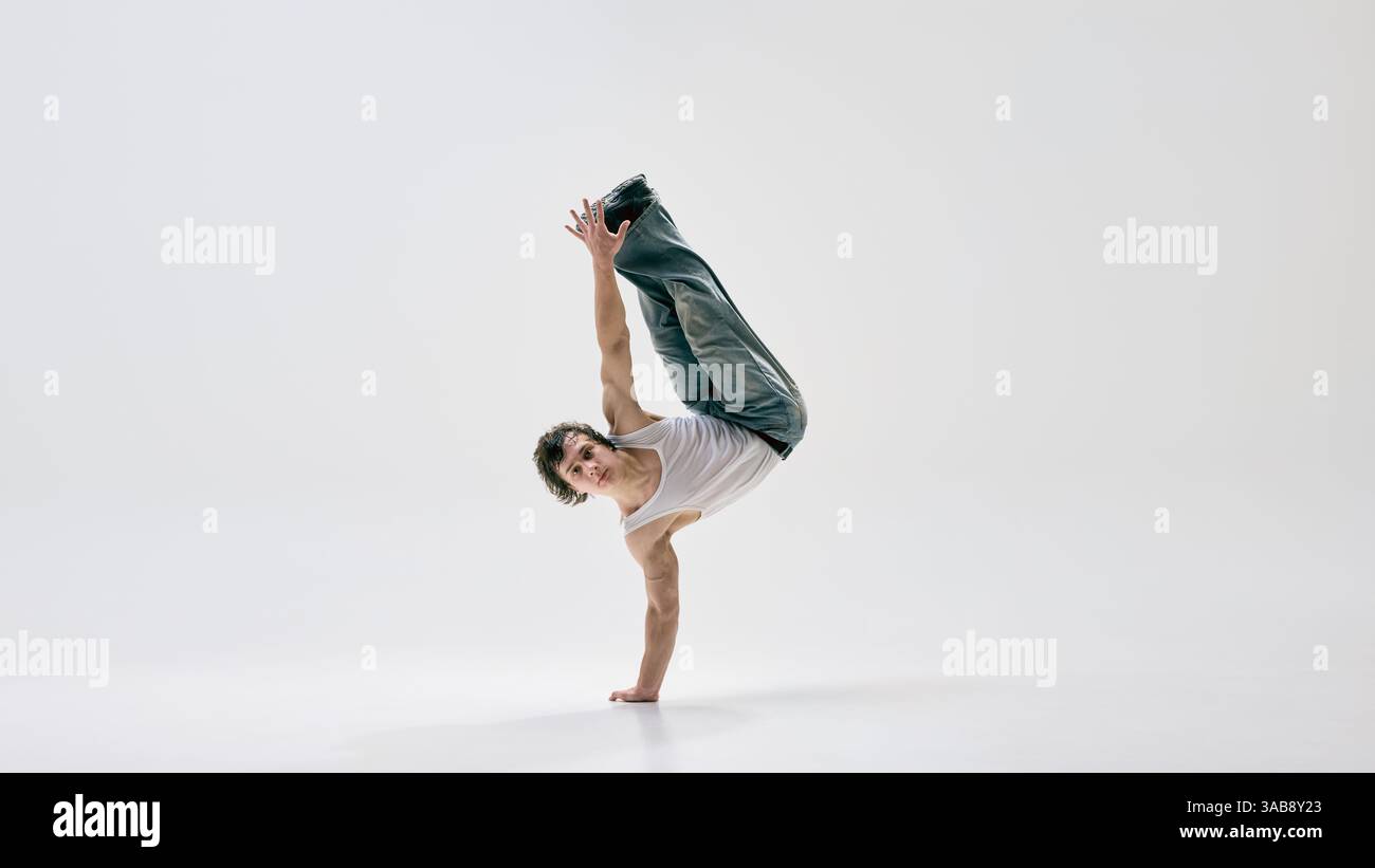 Artistic, talented dance performer twisting mid-motion showcasing ...
