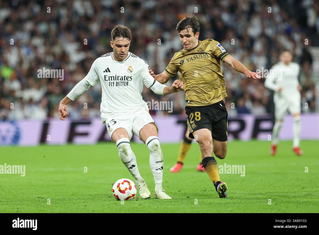 Raul Asencio of Real Madrid and Pablo Marin of Real Sociedad during the ...