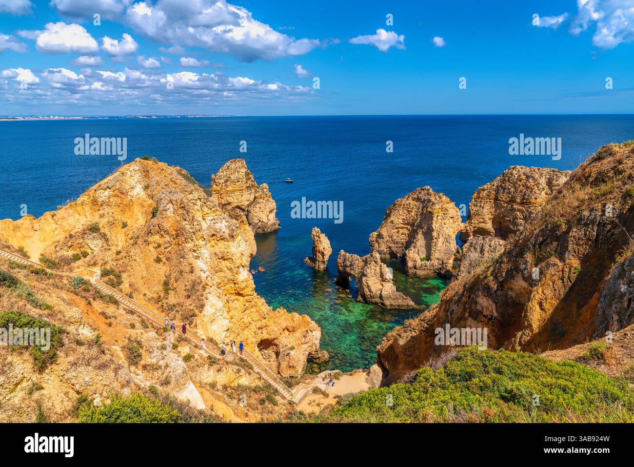 Clear turquoise blue sea Ponta da Piedade coast walk Lagos Portugal ...