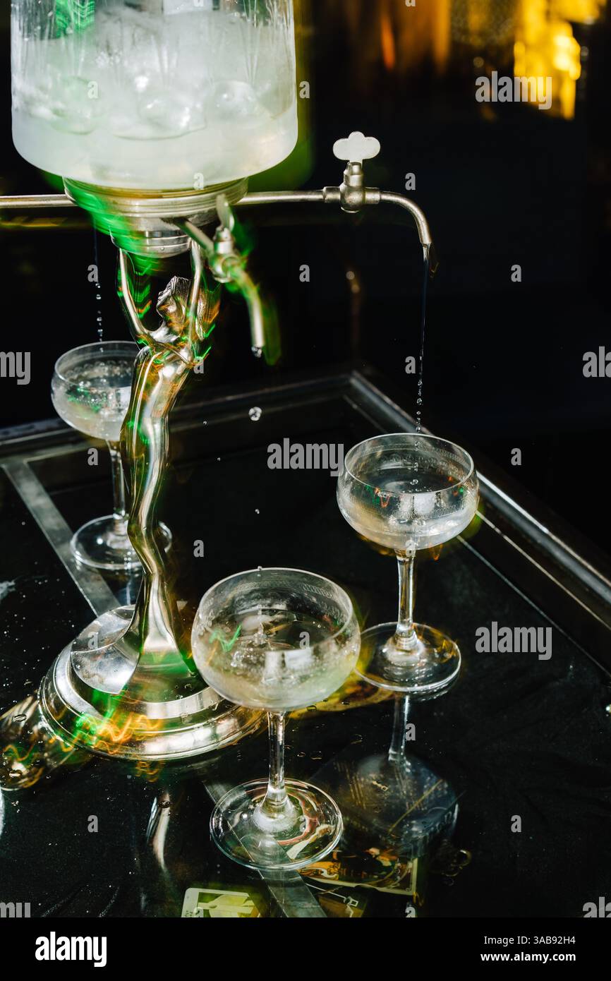 A visually captivating absinthe ritual featuring a traditional fountain ...