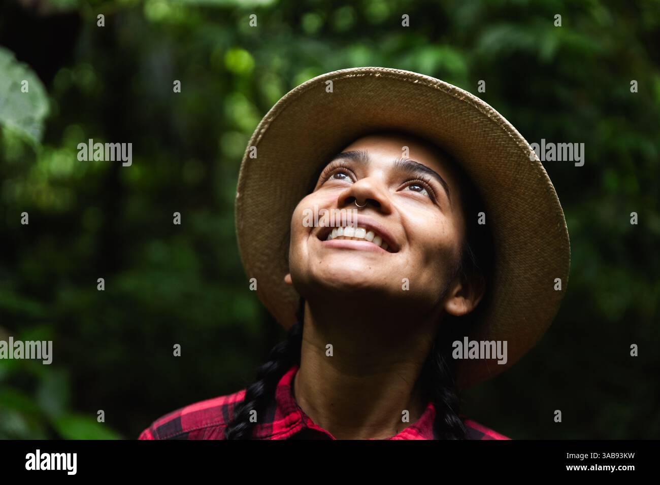 In the biodiverse Choco Andino rainforest in Ecuador, a young ...