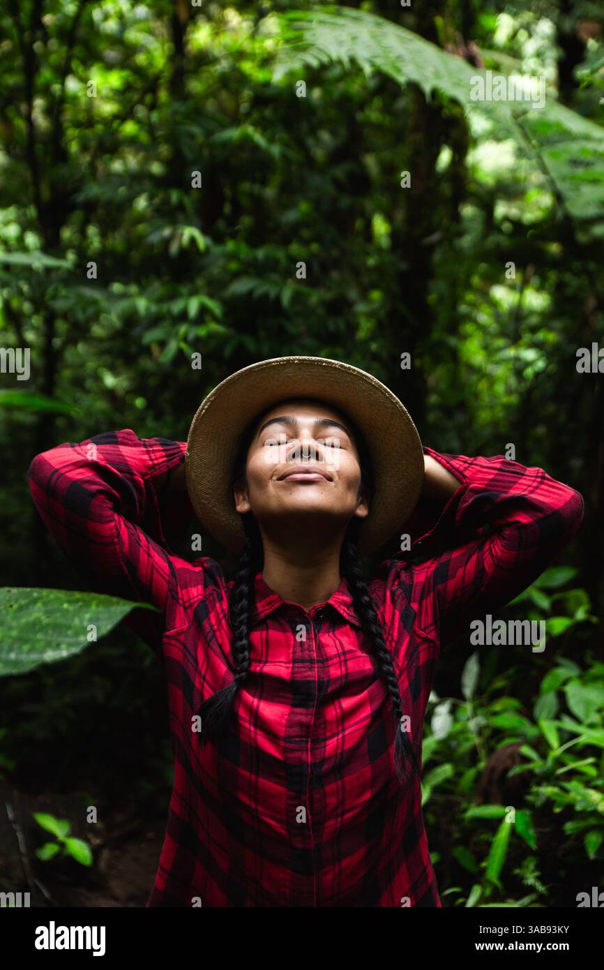 An Ecuadorian woman enjoys the natural beauty of the Choco Andino ...