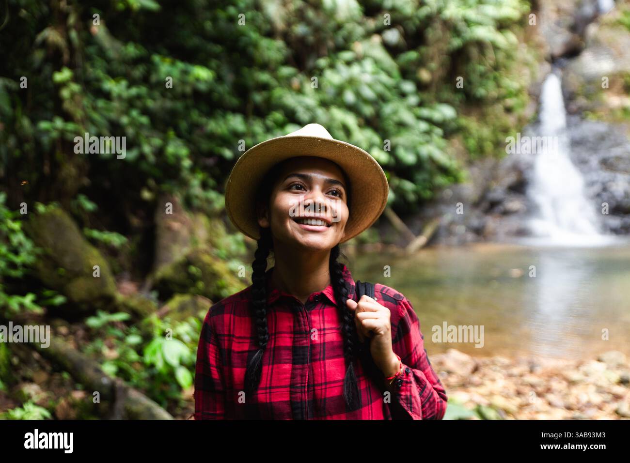 Portraying a joyful Ecuadorian woman during a rainforest trek in ...