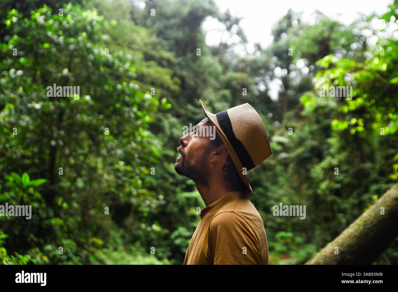 Side view of a spanish man with a hat breathes in the fresh air of the ...