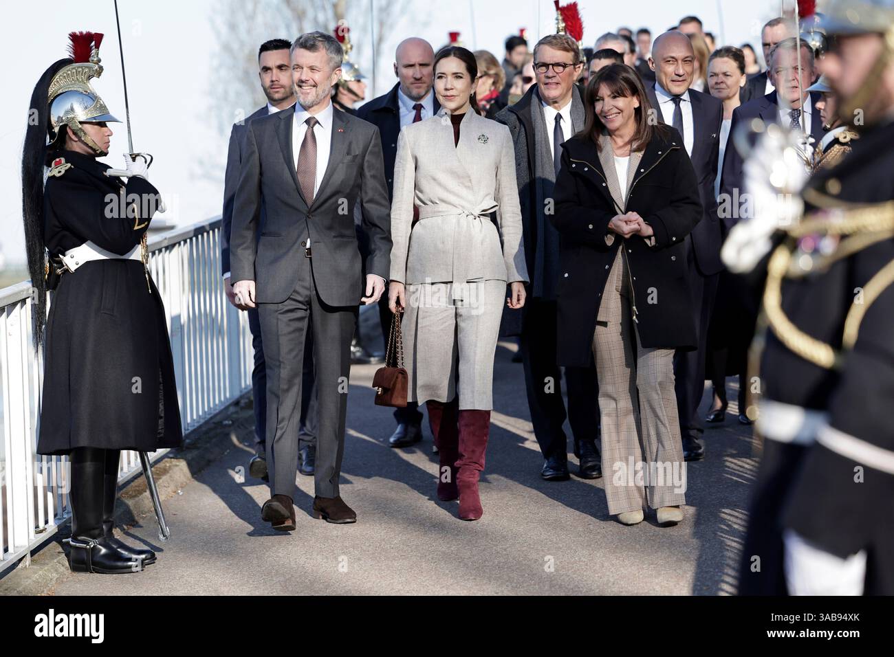 Paris mayor Anne Hidalgo, right, walks with King Frederik X and Queen ...