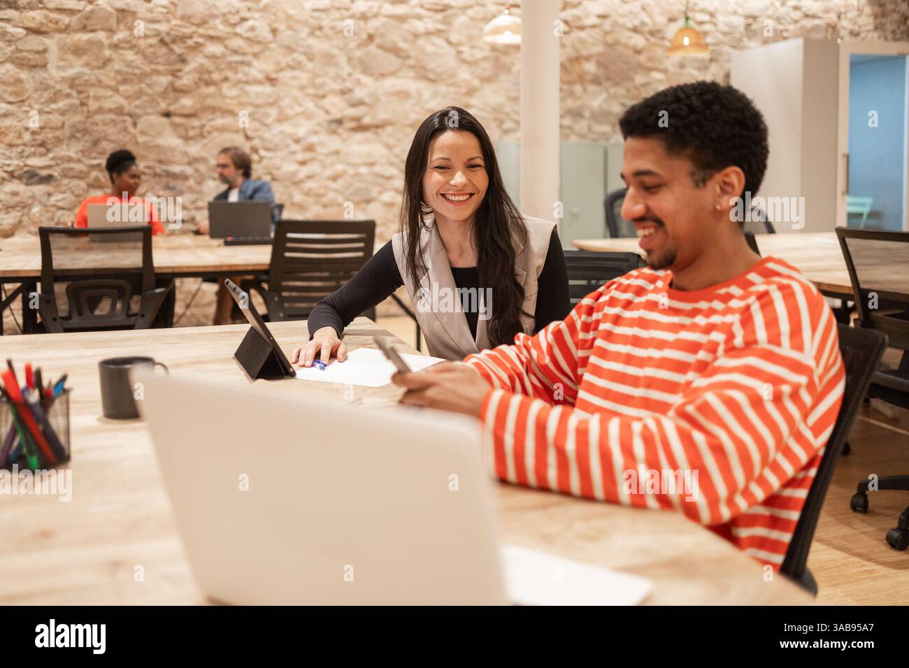 Collaborating office diverse team social hi-res stock photography and ...