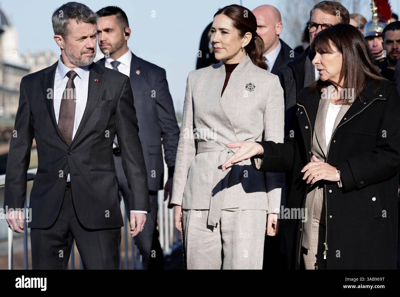 Paris mayor Anne Hidalgo, right, walks with King Frederik X and Queen ...