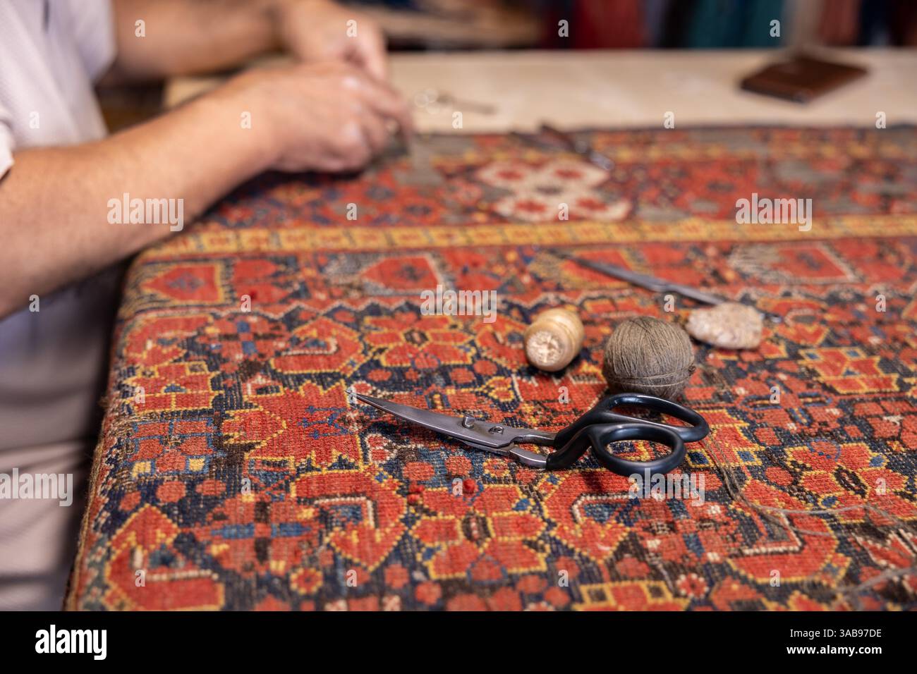 Cropped unrecognizable Iranian master meticulously restores rare ...