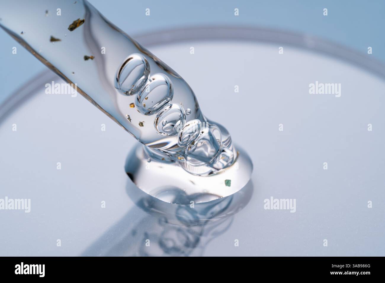 Macro shot of a cosmetic pipette filled with liquid, showcasing air ...