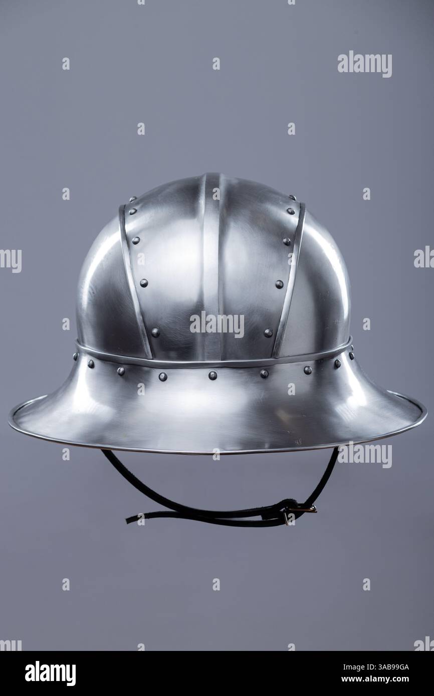 Silver Helmet with Wide Brim and Rivets. This image shows a shiny ...