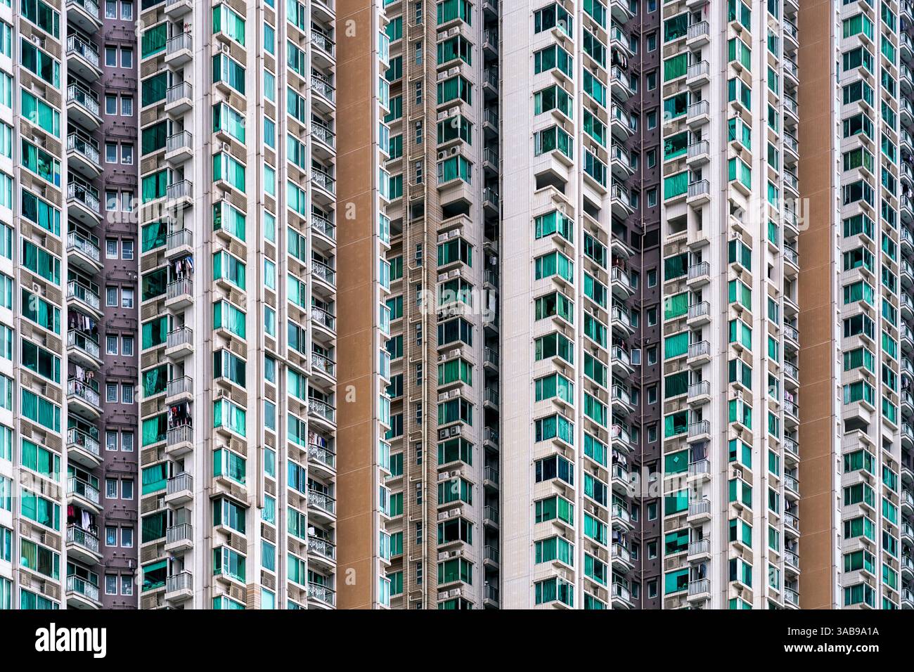 Close-up view of numerous high-rise residential towers densely packed in Hong Kong, showcasing ...