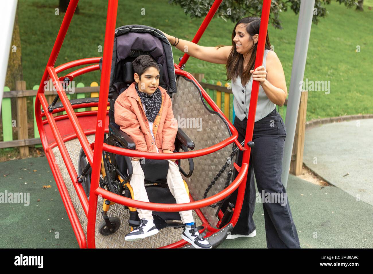 A child with cerebral palsy sits in a specialized wheelchair accessible ...