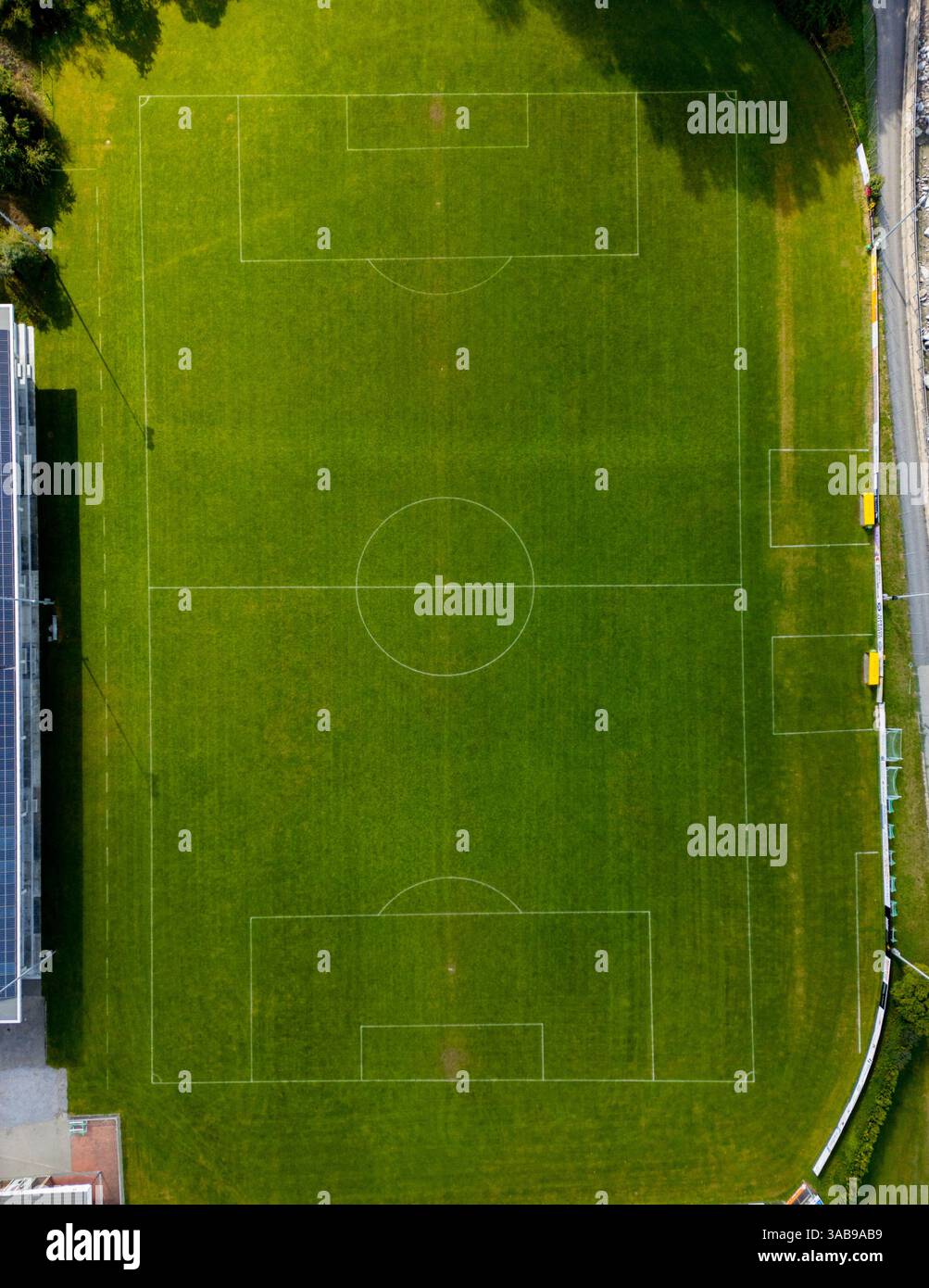 Aerial view of a football field in Brig, showcasing vibrant green grass ...