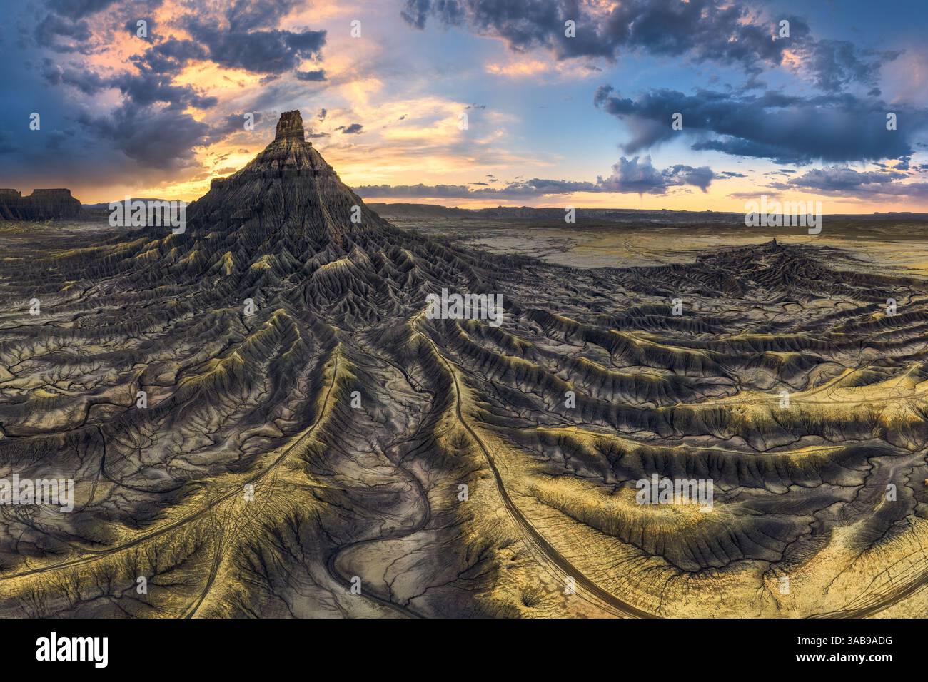 Spectacular aerial view of Factory Butte at sunset with vivid sky ...