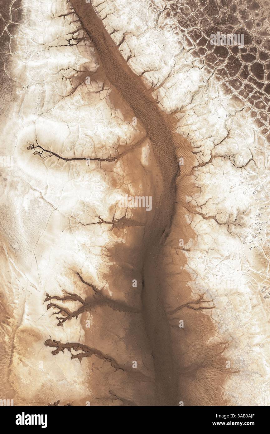Aerial view showcasing an intricate pattern of winding cracks and ...