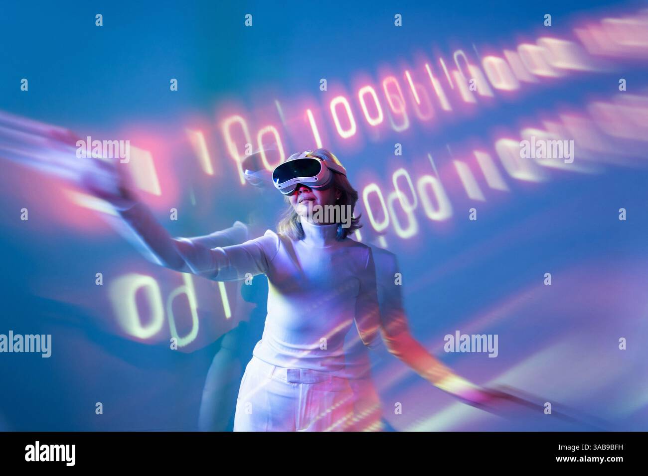 An elderly Asian woman experiences the metaverse using virtual reality technology, engaging with ...