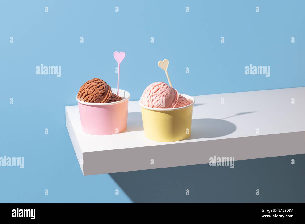 A modern ice cream composition with chocolate and strawberry scoops ...