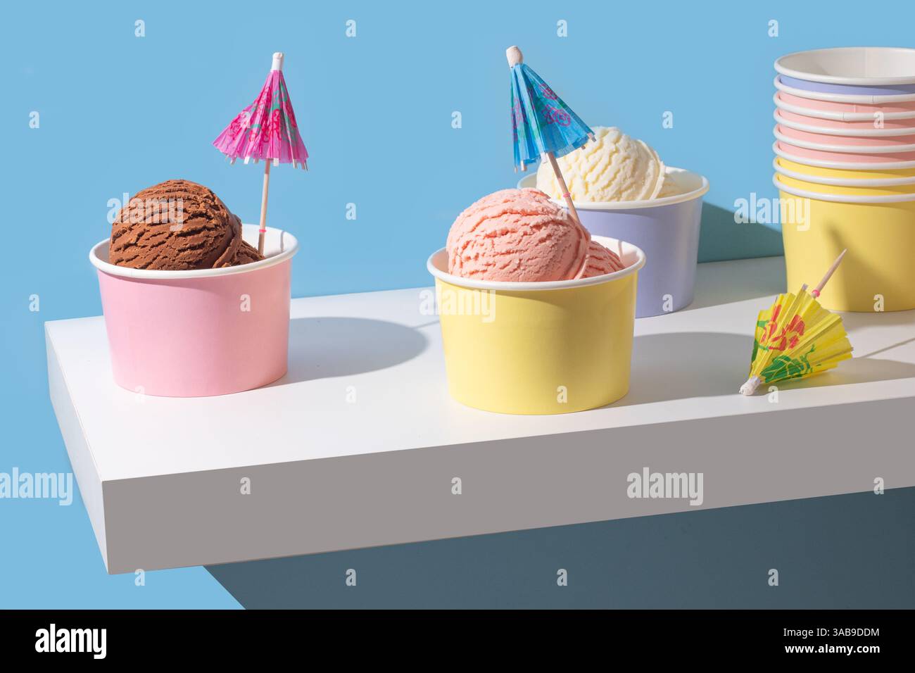 A minimalist presentation of chocolate, strawberry, and vanilla ice ...