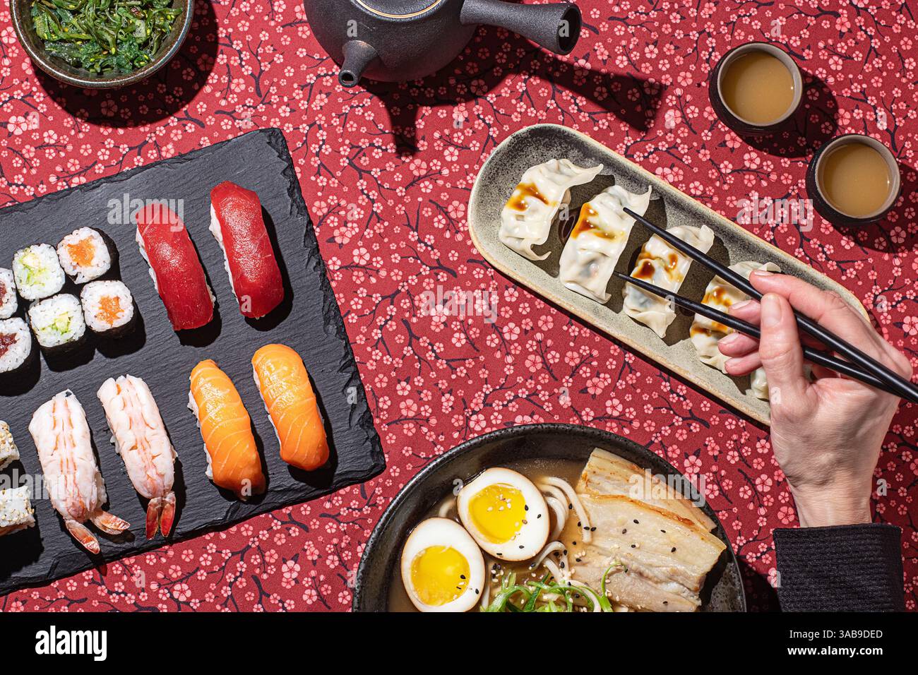 Artistic composition of a traditional Japanese feast, including sushi ...
