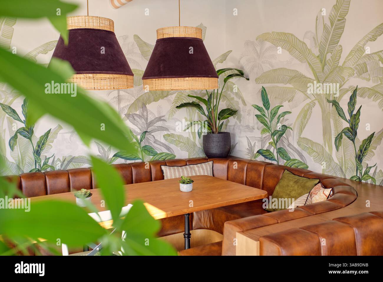 A cozy corner of a restaurant featuring elegant leather booth seating ...