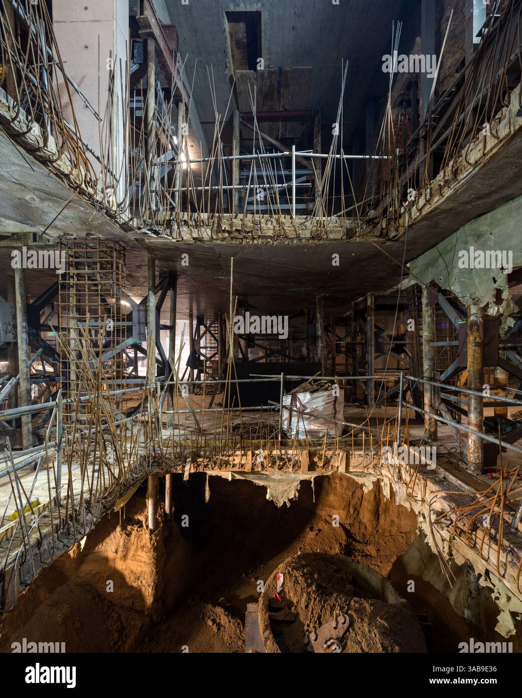 View of an underground construction site with layers of concrete and ...