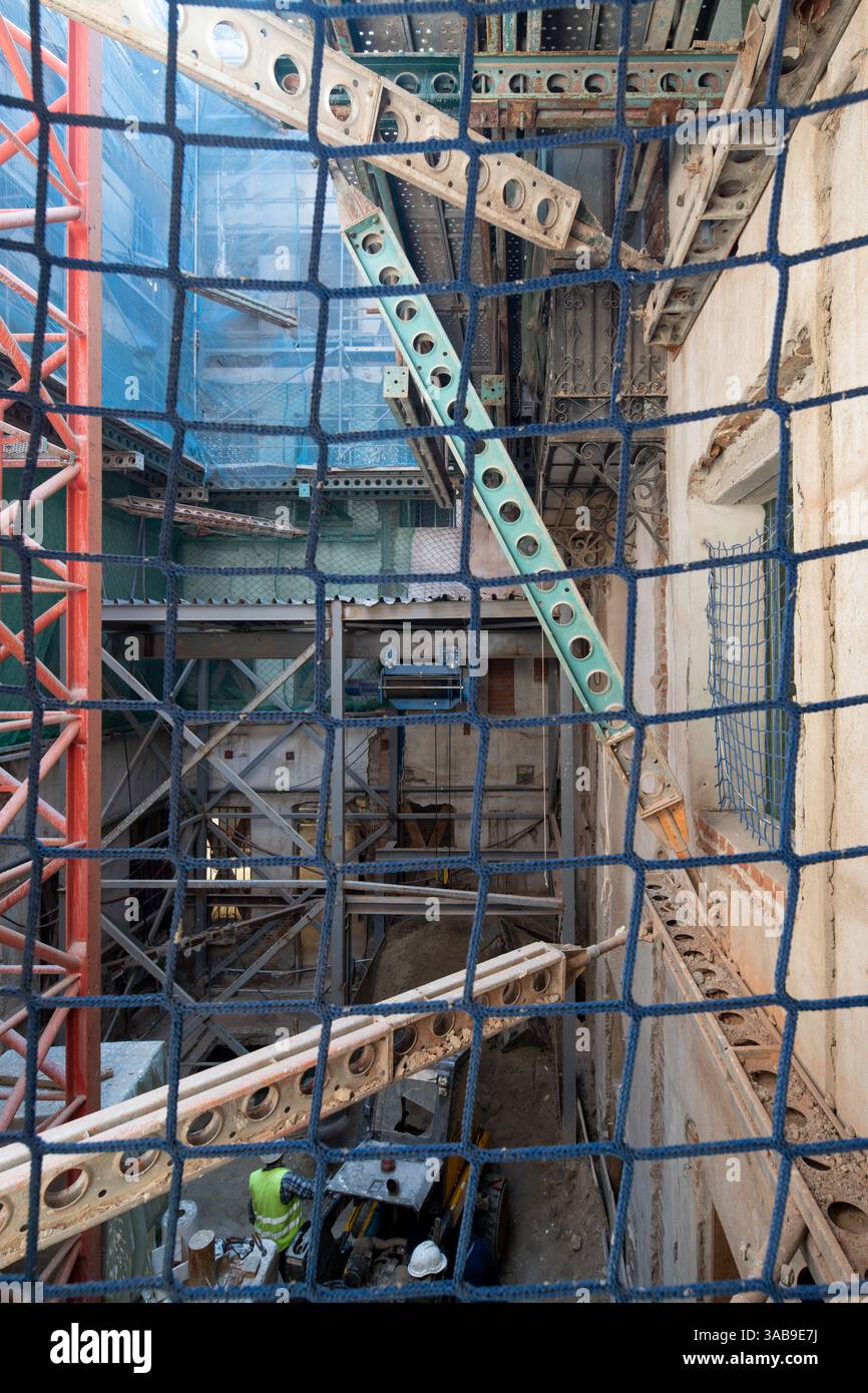 A dynamic view of a construction site showcases scaffolding and safety ...