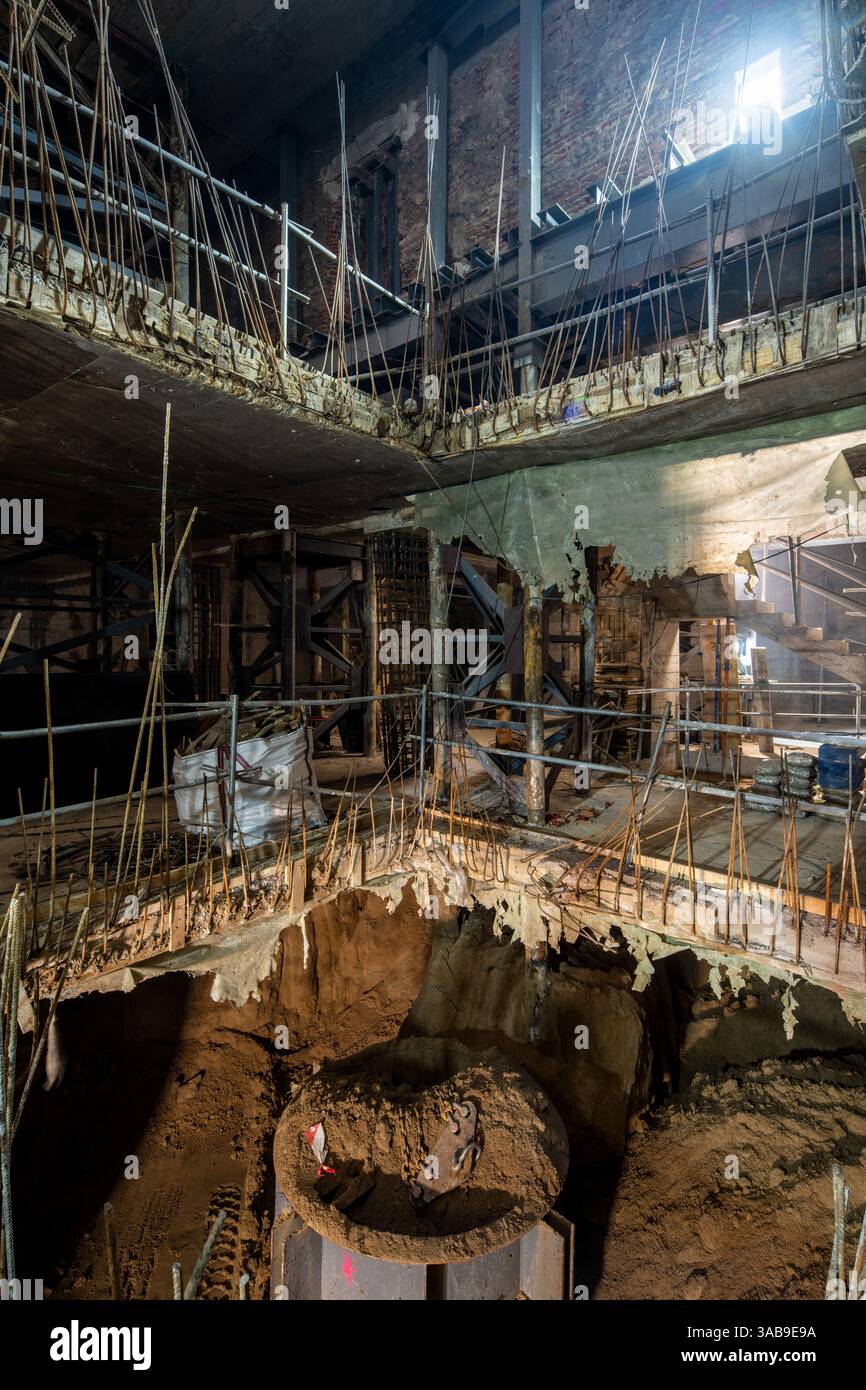 View of an ongoing construction site featuring exposed rebar, concrete ...