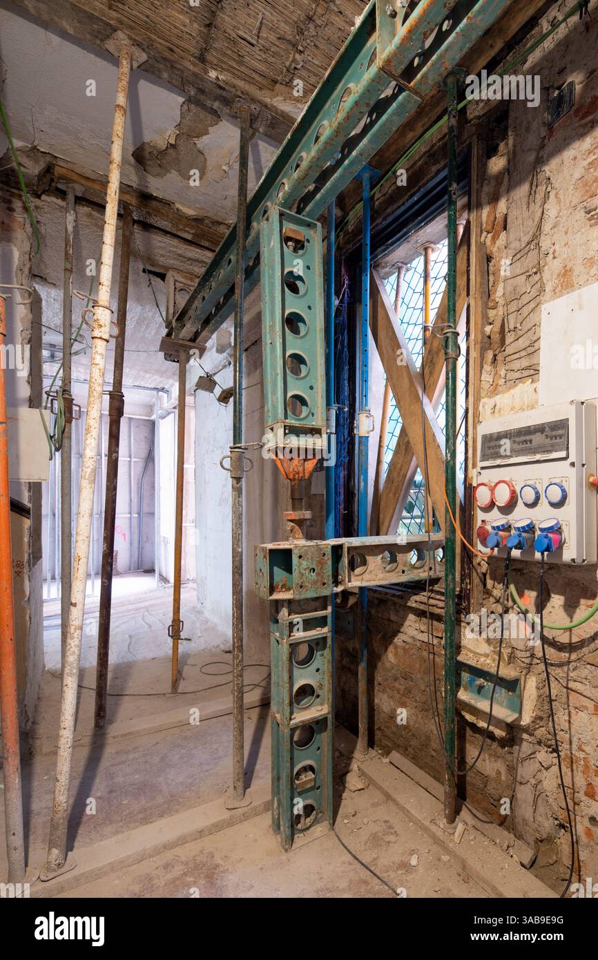 Industrial construction site showing metal support beams, exposed ...