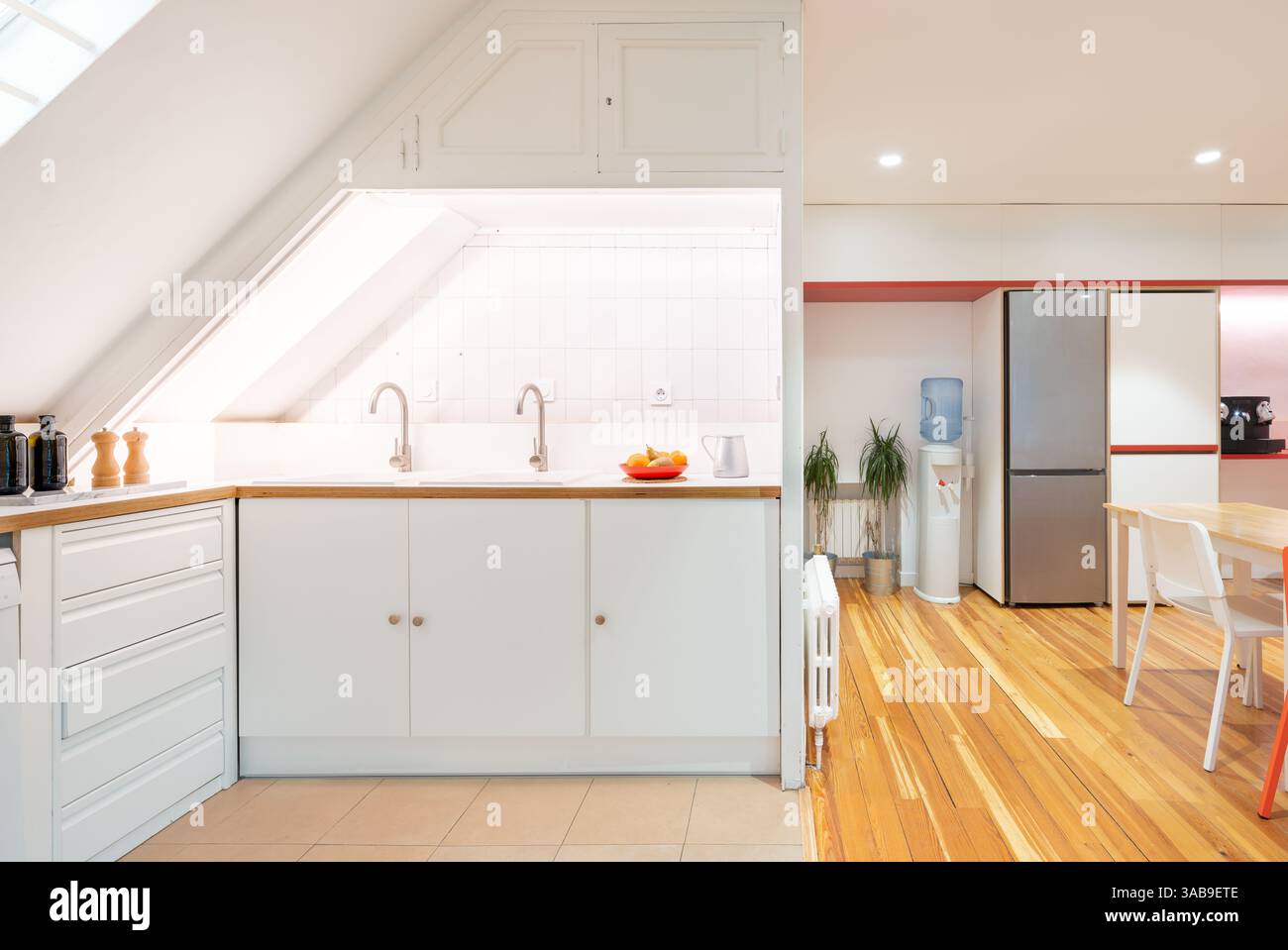 Bright coworking kitchen with sleek minimalist design, featuring wooden ...