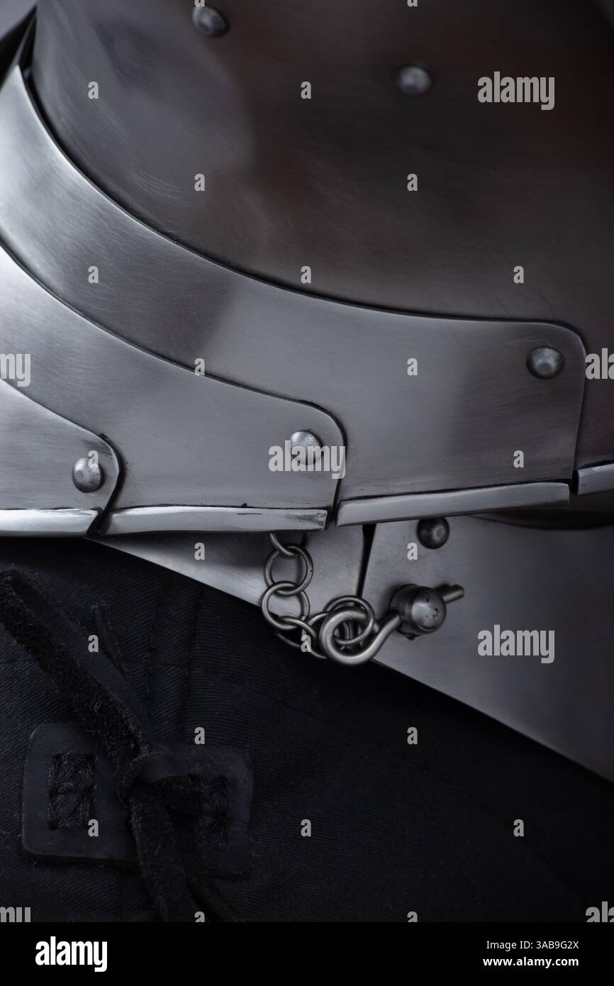 Close-up of medieval armor neck protection with chainmail. A detailed view shows layered metal ...