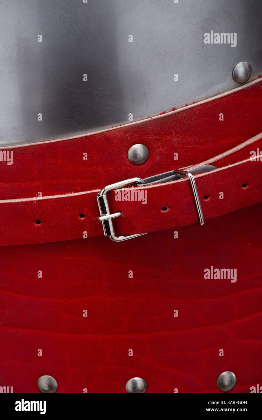 Close-up of a red leather helmet strap with buckle. A detailed close-up ...