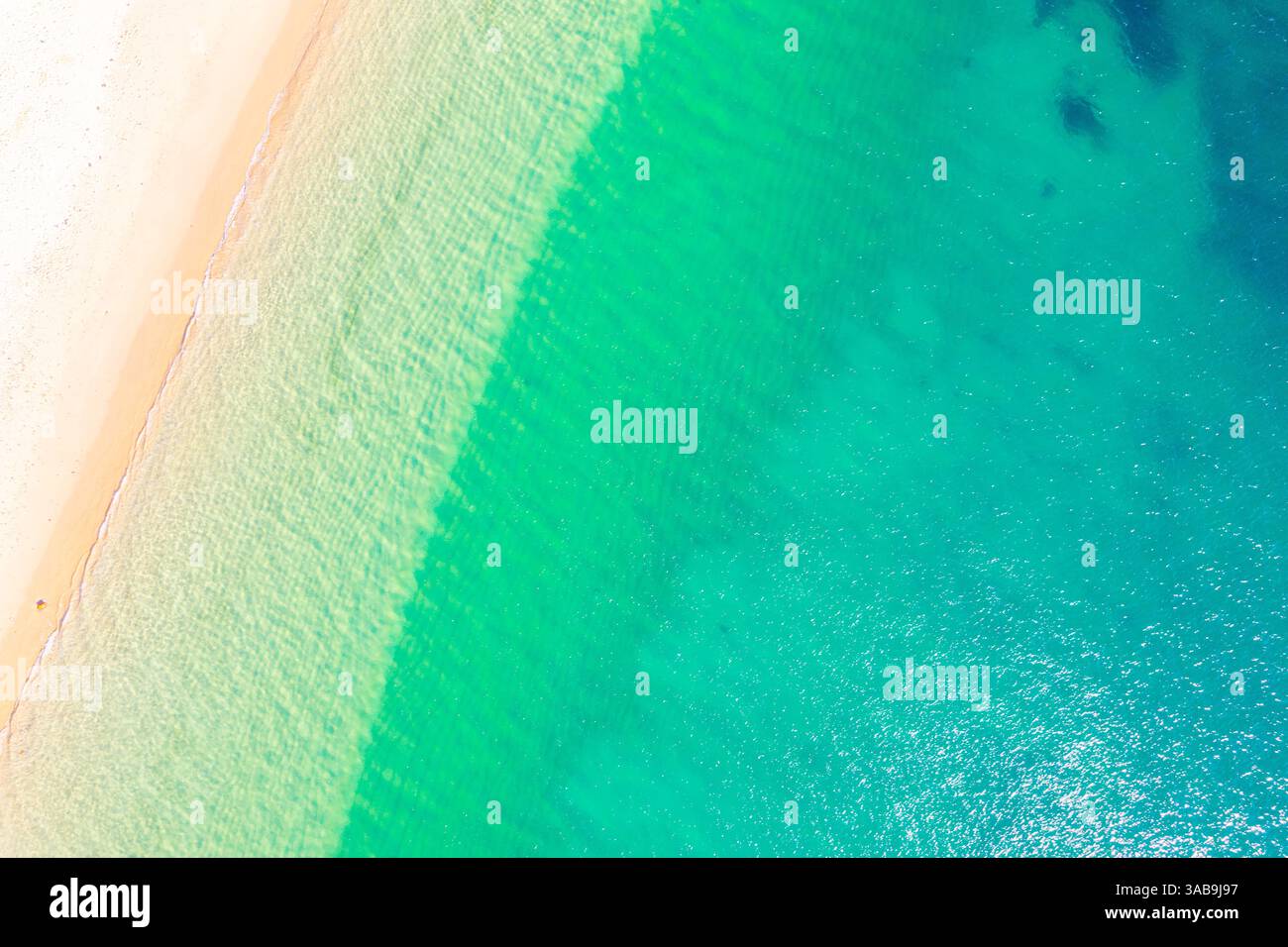 aerial top down view of pristine beach with turquoise water, overhead ...