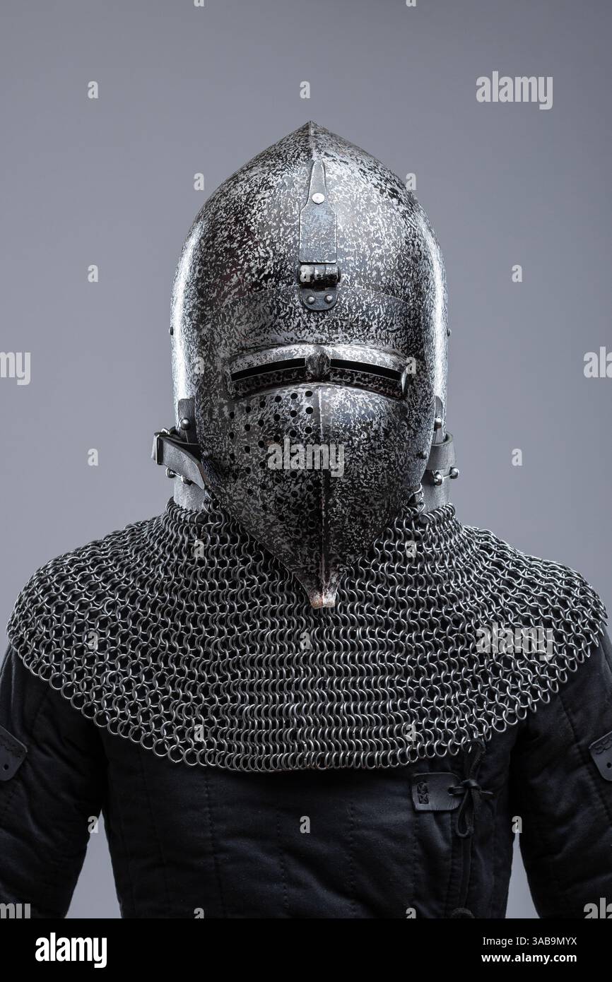 Dark Metal Helmet with Pointed Top and Faceplate. This image shows a ...