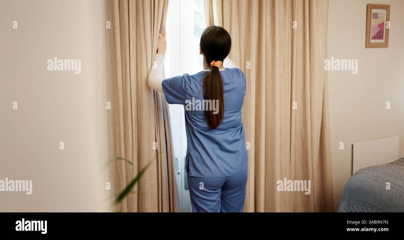 Curtain, opening and sunlight with nurse in hospital for start of ...