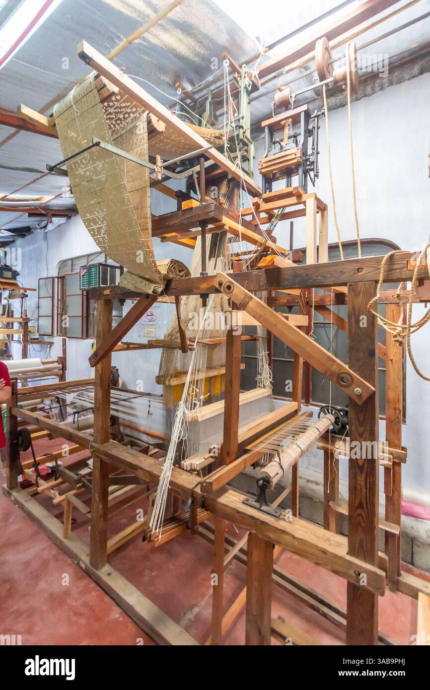 Piña fiber weaving on a wooden mechanical loom in Aklan, Philippines, a ...