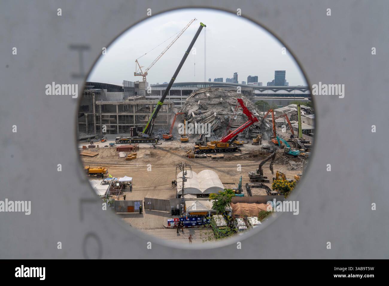 April 2, 2025, Bangkok, Bangkok, Thailand: Heavy machinery is used to ...