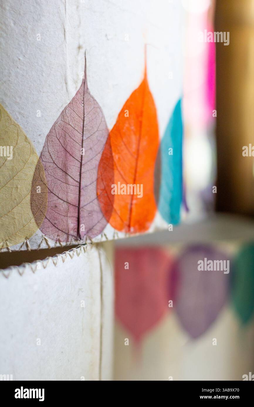 Artisan handmade paper with real colored leaves on display at a paper ...