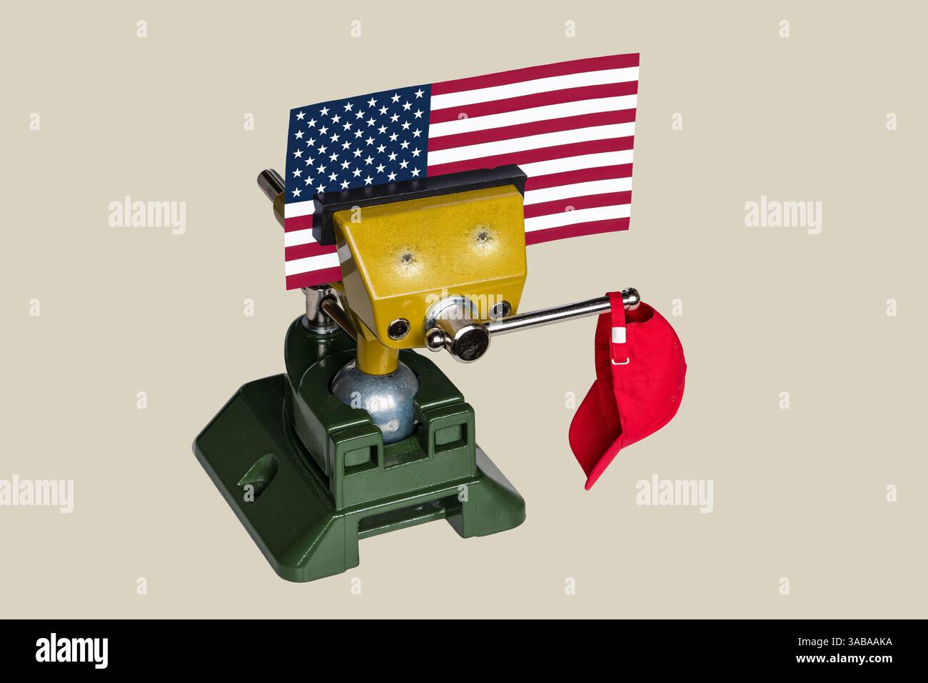 Political illustration: the U.S. flag clamped in a carpenter’s vice ...