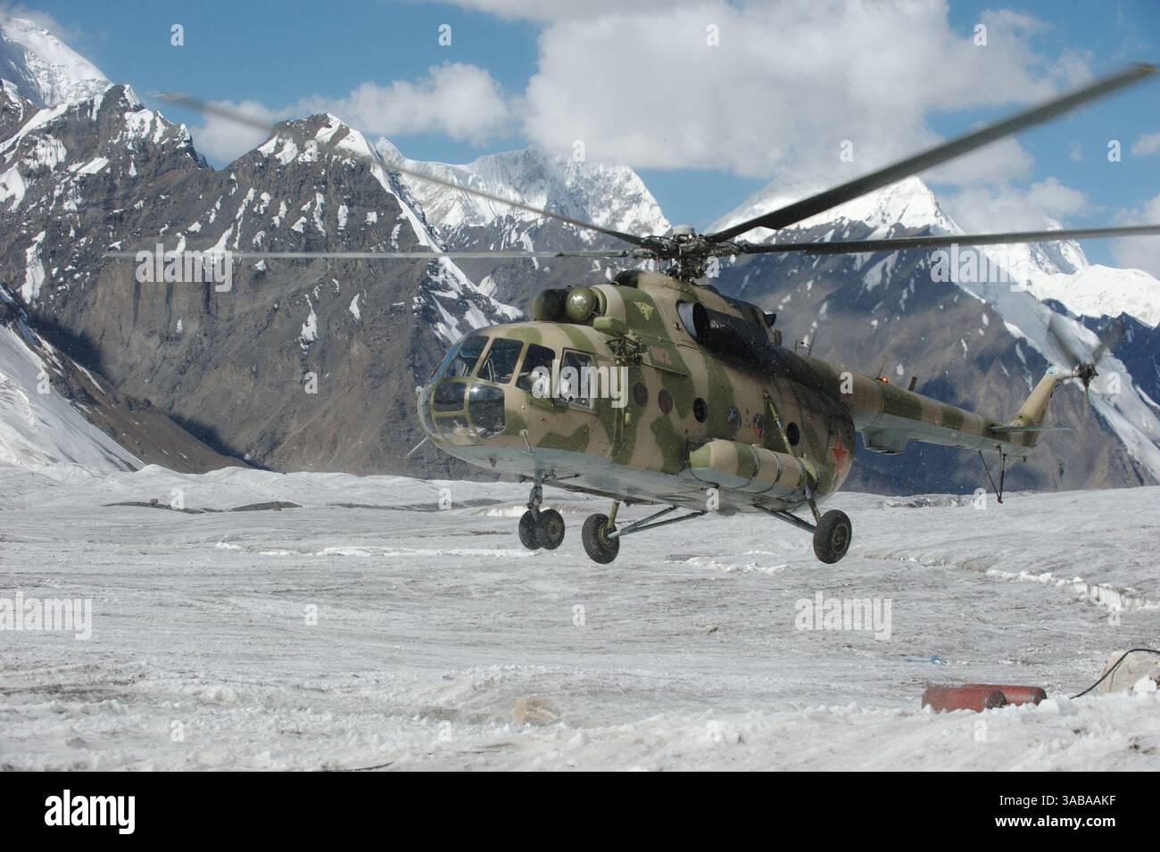 Rescue helicopter at the base camp. The foot of Khan Tengri Peak Stock ...