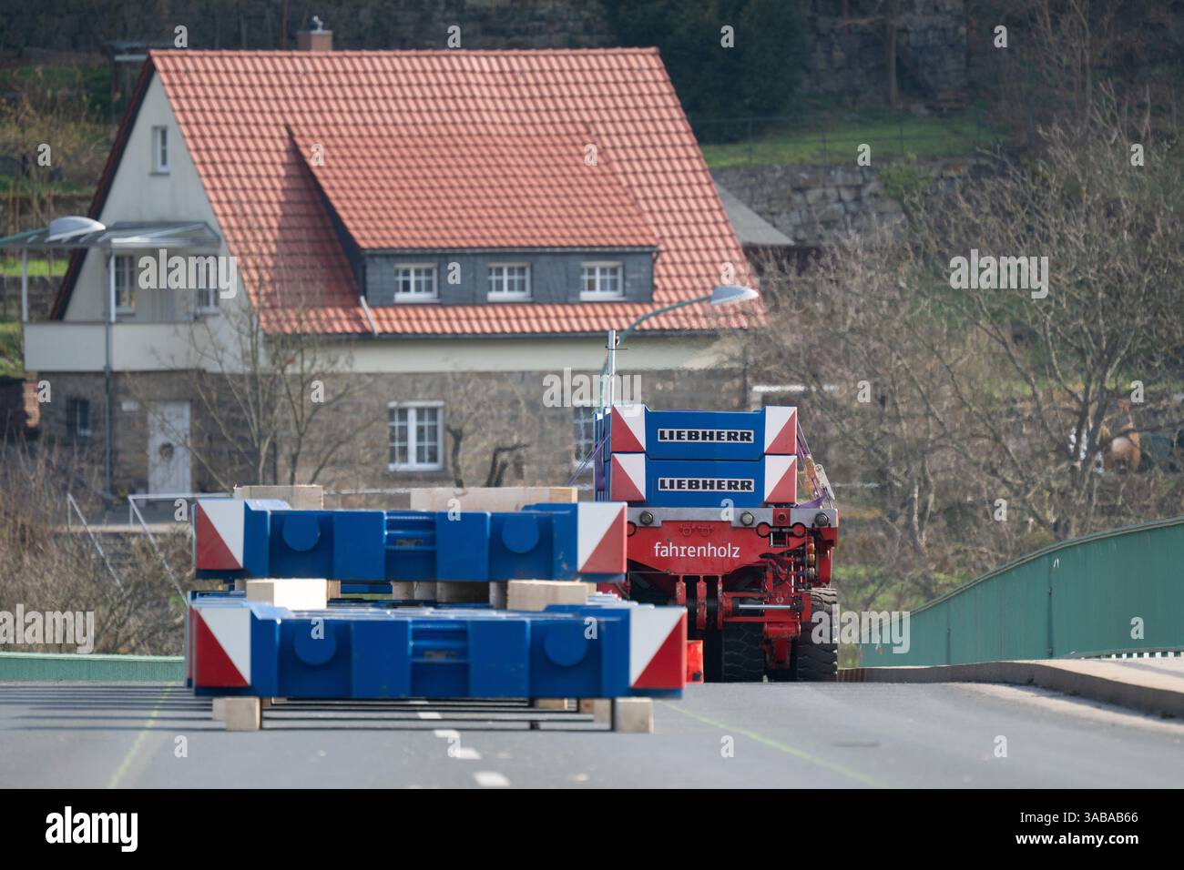 02 April 2025, Saxony, Bad Schandau: A heavy-duty module loaded with ...
