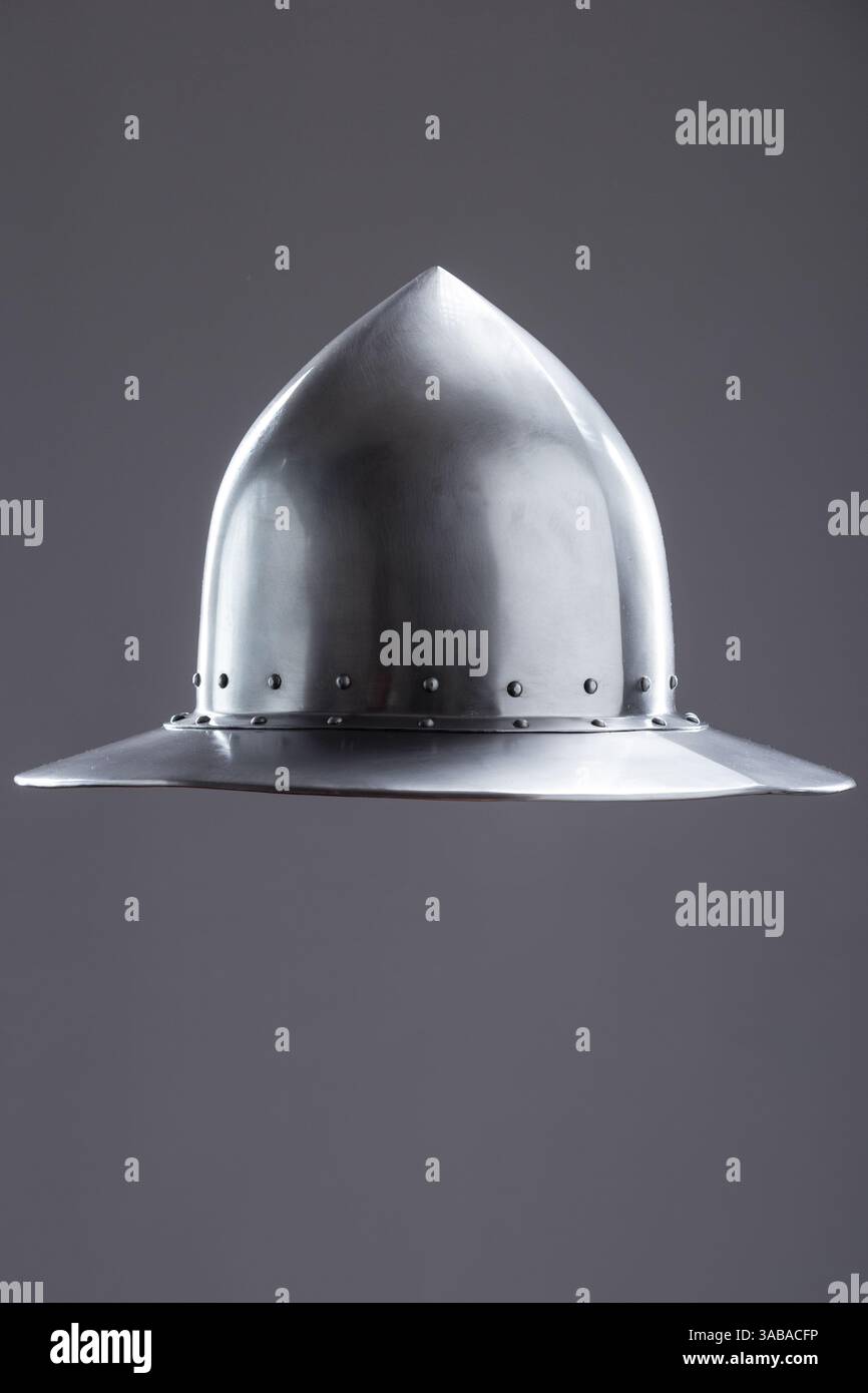 Polished steel medieval infantry kettle hat. Front view of a polished ...