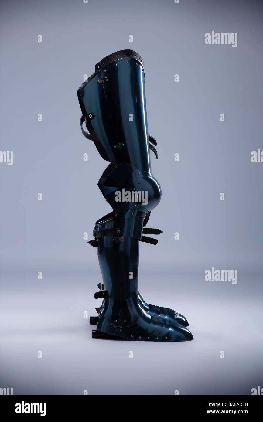 Shiny Steel Medieval Leg Armor. Full leg protection with straps and buckles detail Stock Photo ...