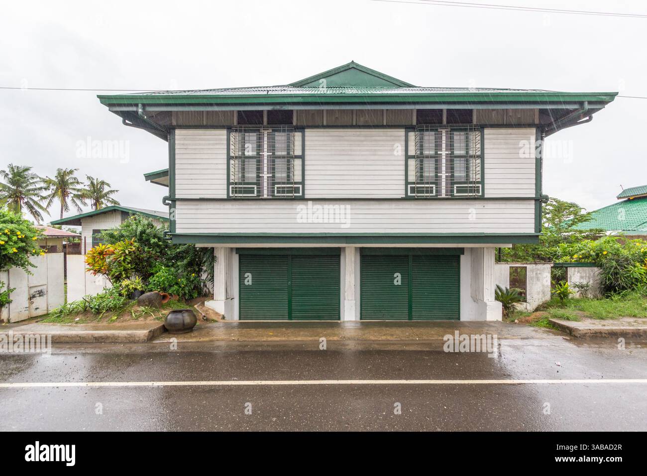 Two-story wooden Filipino ancestral house built in the 1950s located in ...
