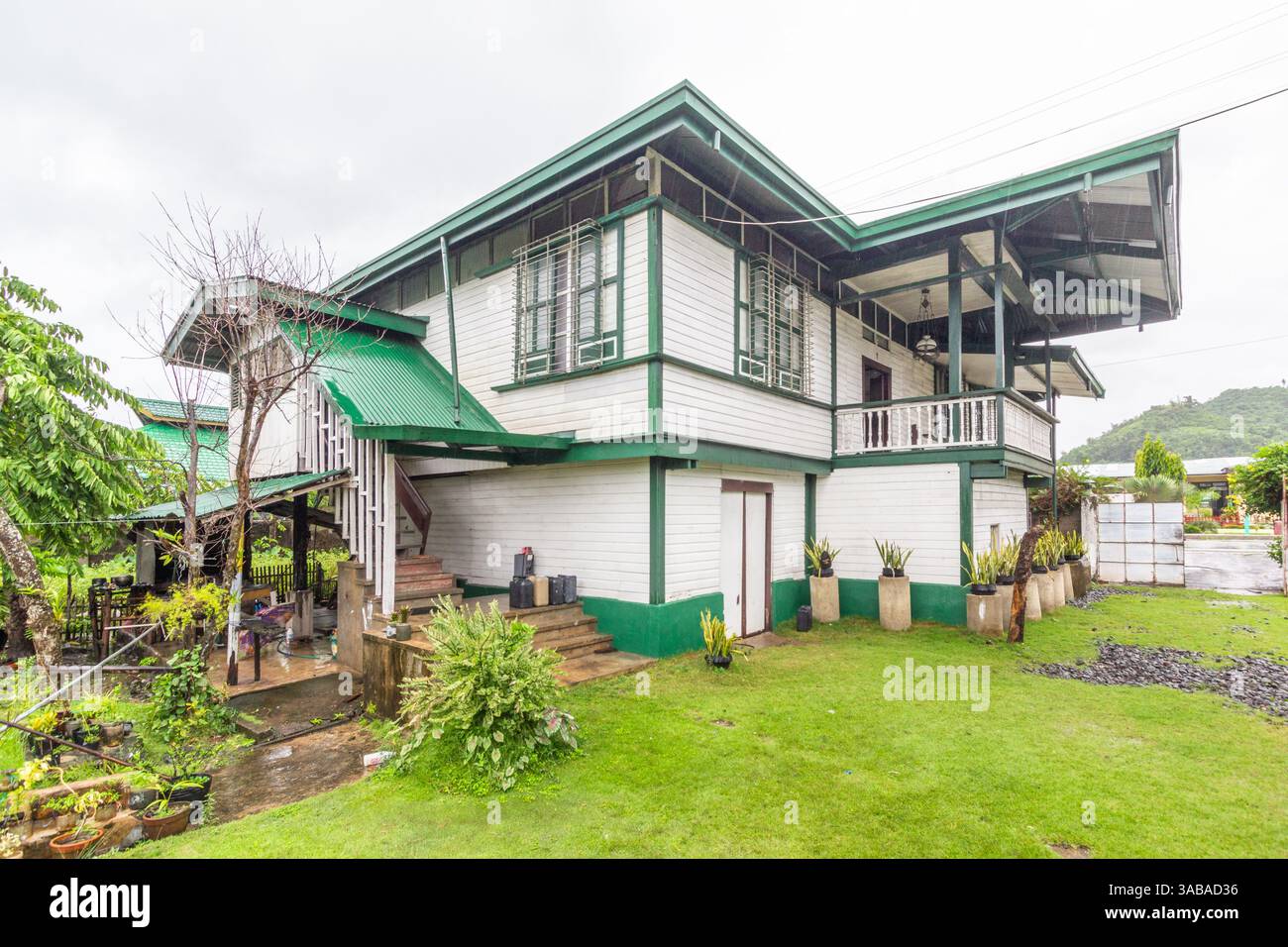 Two-story wooden Filipino ancestral house built in the 1950s located in ...