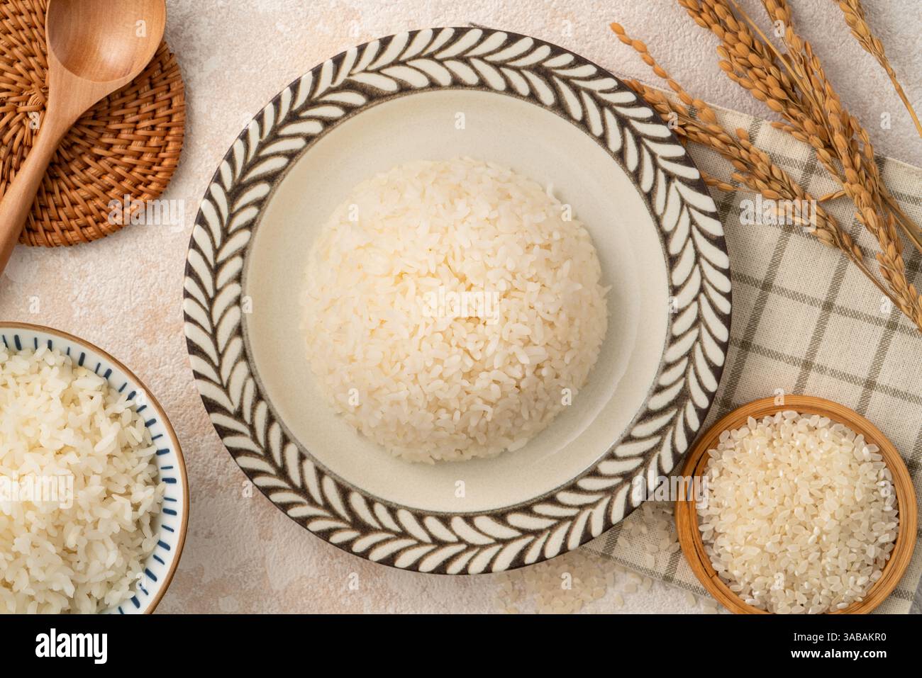 A bowl of freshly cookd steamed white rice, soft, fluffy, and slightly ...