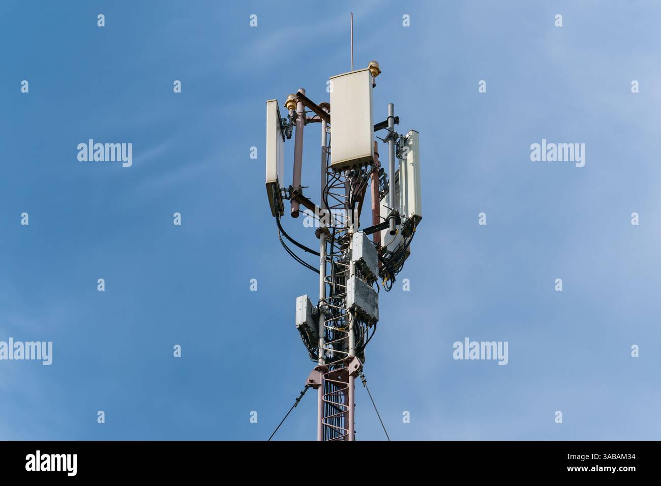 Close-up of the top of a tall mast with mobile cellular antennas Stock ...