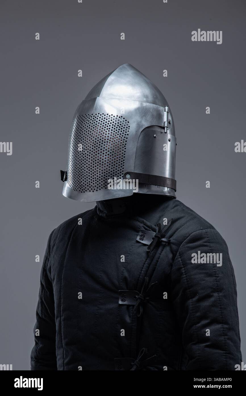 Front View of a Shiny Perforated Medieval Helmet. This image presents a ...